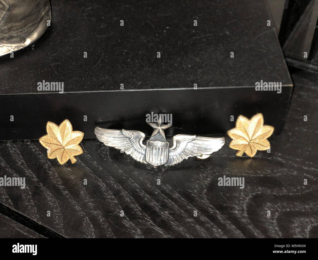 Major rank insignia and pilot wings sit on a table. U.S. Air Force Maj ...