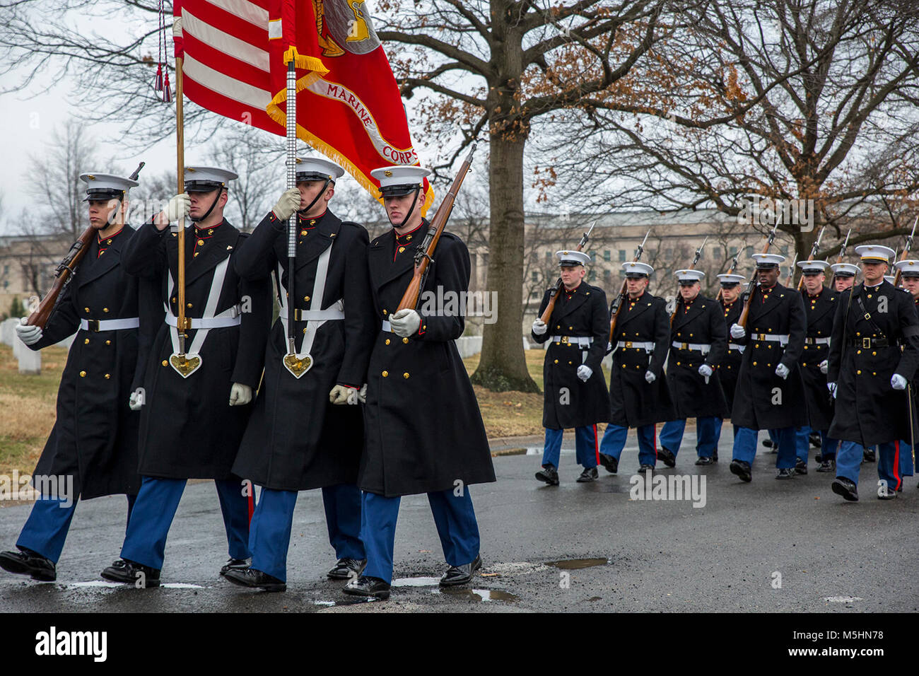 The Marine Corps Color Guard marches with the National Flag and the ...