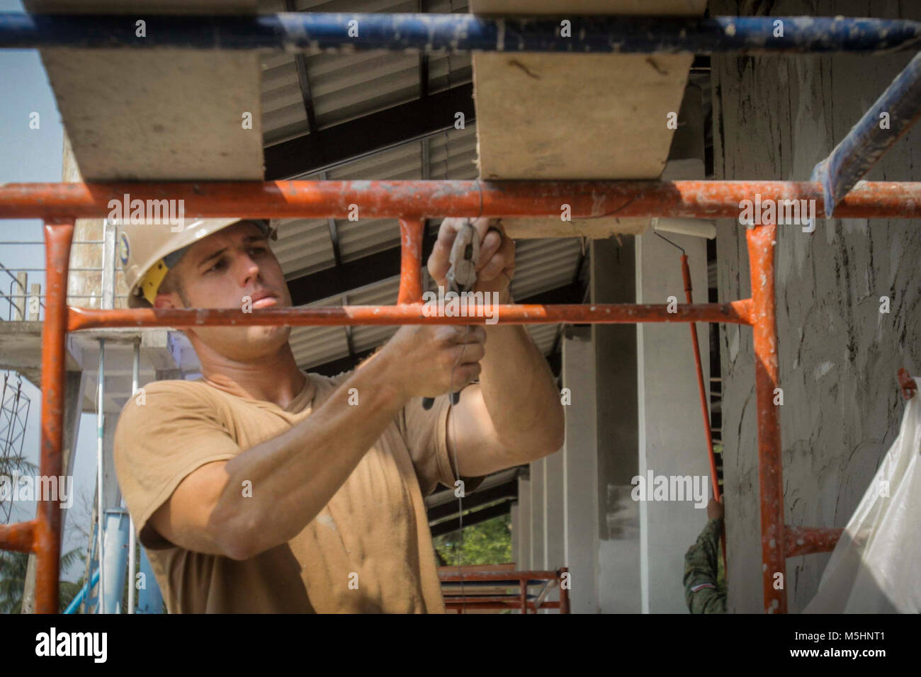 U.S. Navy sailor Builder 1st Class Corey Roberts, a project supervisor ...