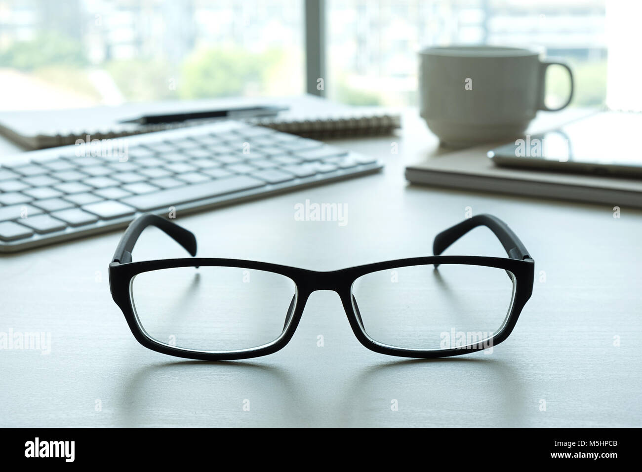 Close up of glasses and computer business workplace work place in ...