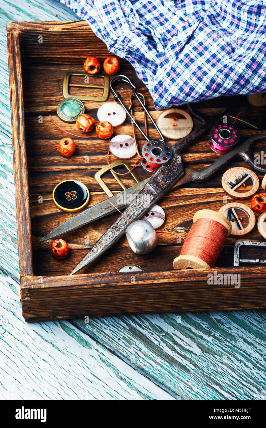 sewing kit from sewing thread, buttons and fabric Stock Photo - Alamy