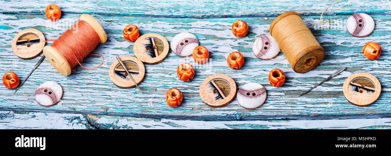 sewing kit from sewing thread, buttons and fabric Stock Photo - Alamy