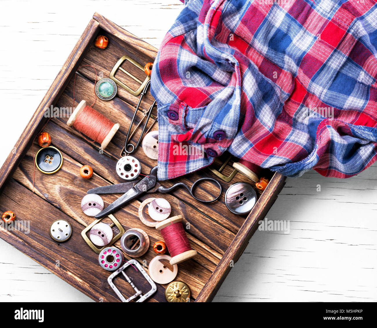 sewing kit from sewing thread, buttons and fabric Stock Photo - Alamy