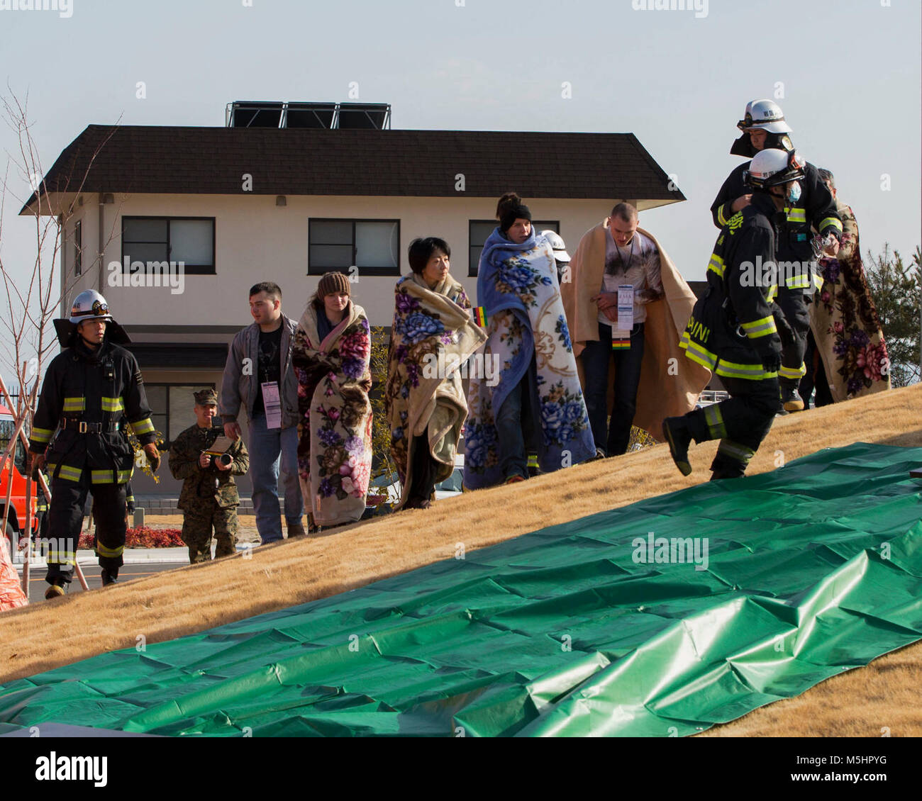 Iwakuni City Fire and Japanese emergency personnel assist simulated ...