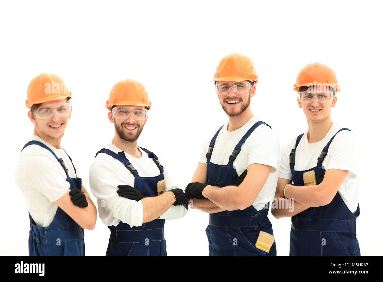 smiling team of construction workers Stock Photo - Alamy