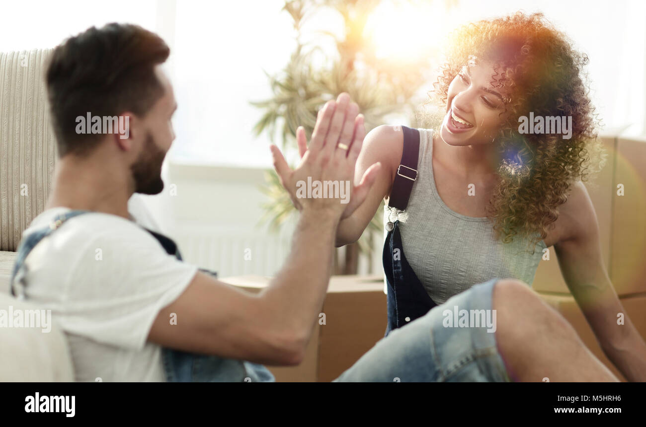 young couple giving each other five with a new home Stock Photo - Alamy