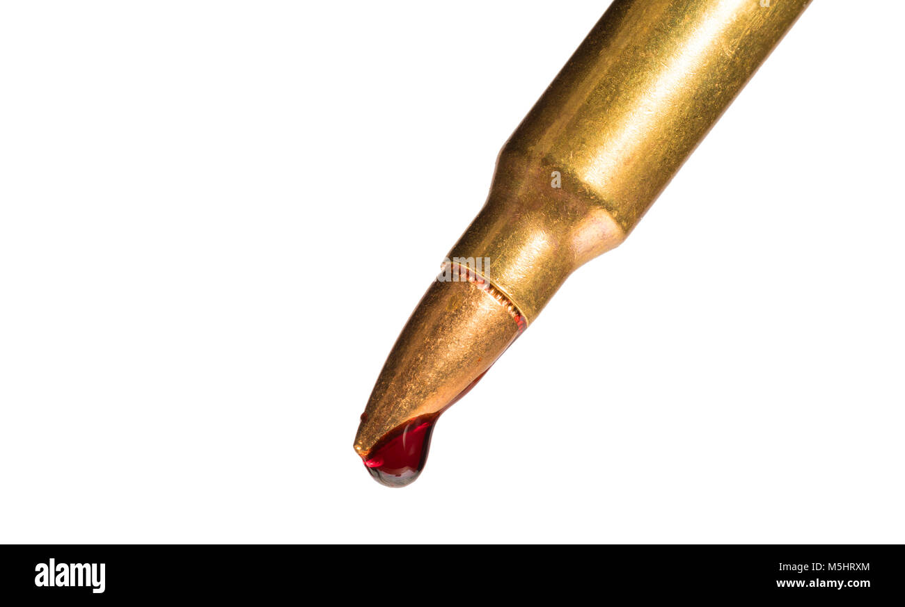 Blood droplet on the end of an assault rifle cartridge isolated on ...