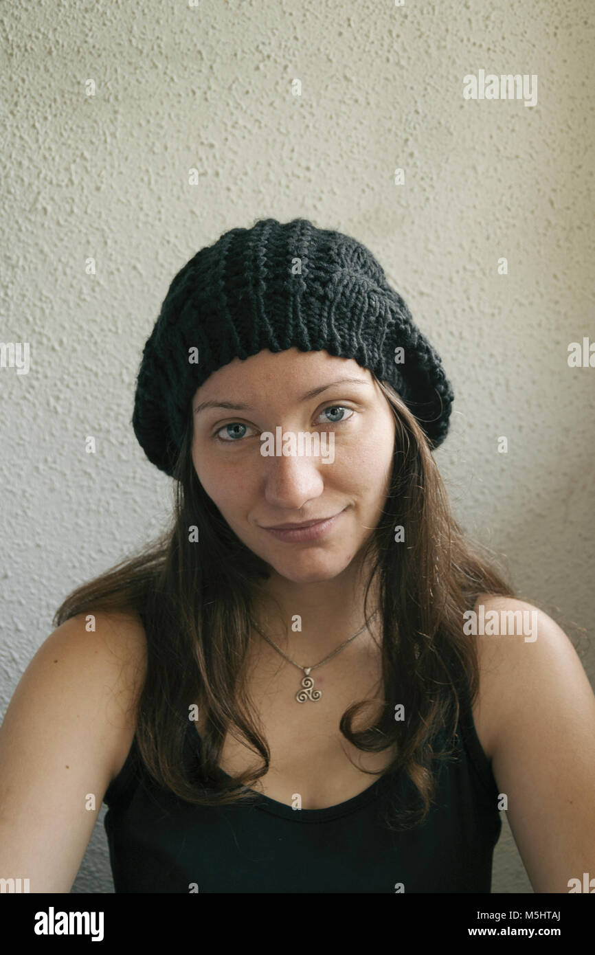 long-haired girl and blue eyes with hat smiling Stock Photo - Alamy
