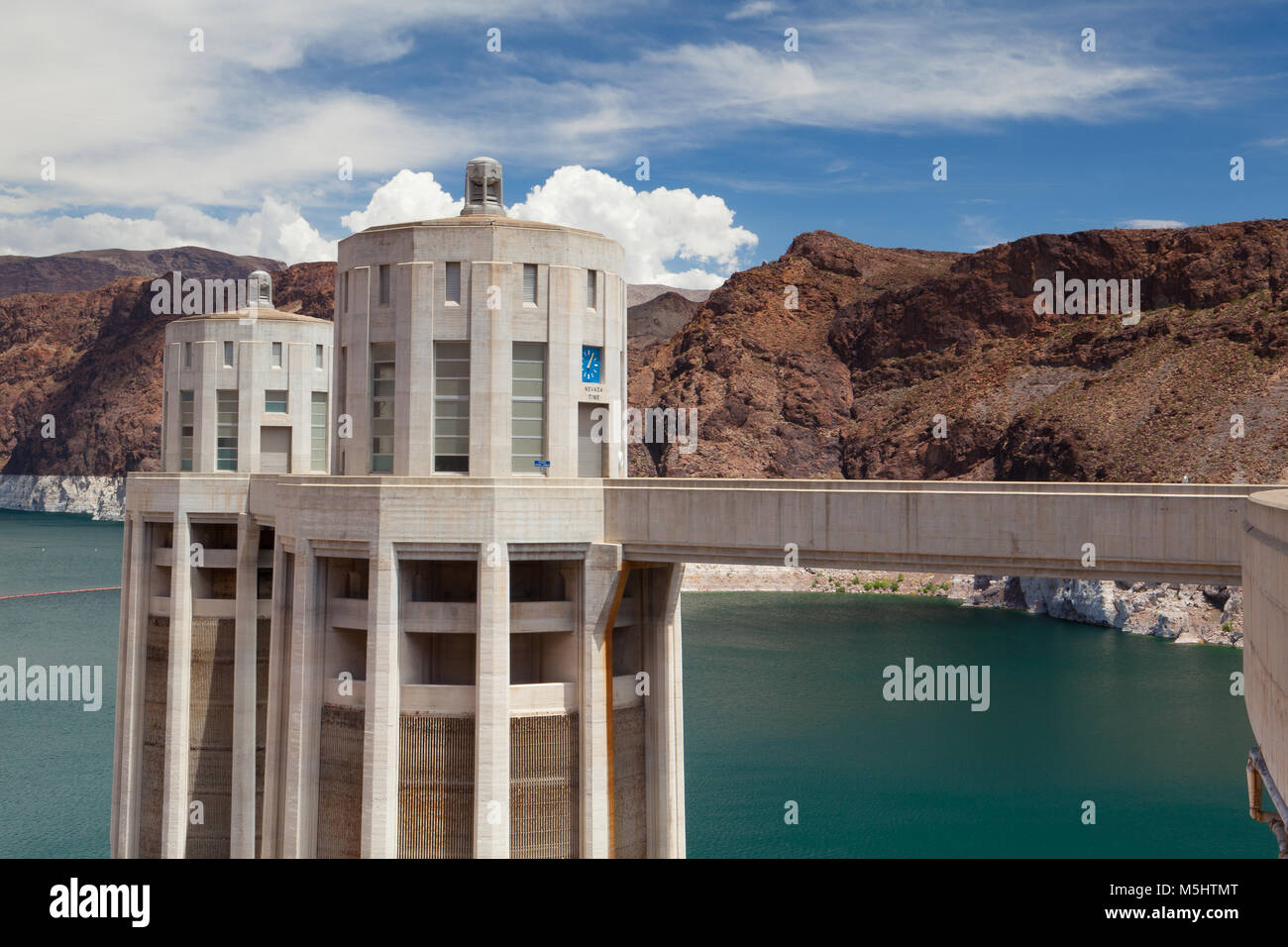 Hoover Dam Towers on the blue Lake Mead. Hoover Dam is a concrete arch-gravity dam in the Black ...