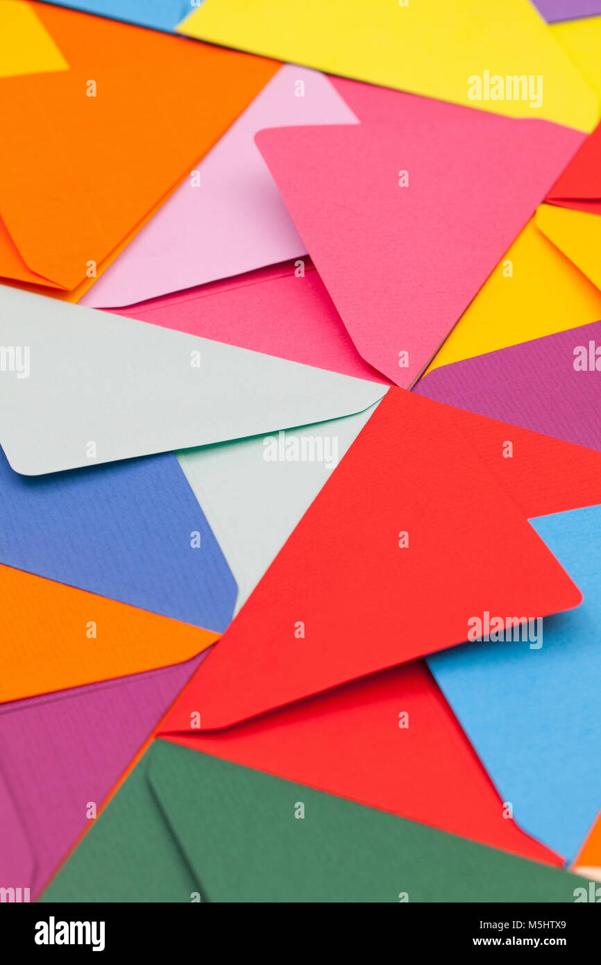 Different colored envelopes on the table Stock Photo - Alamy