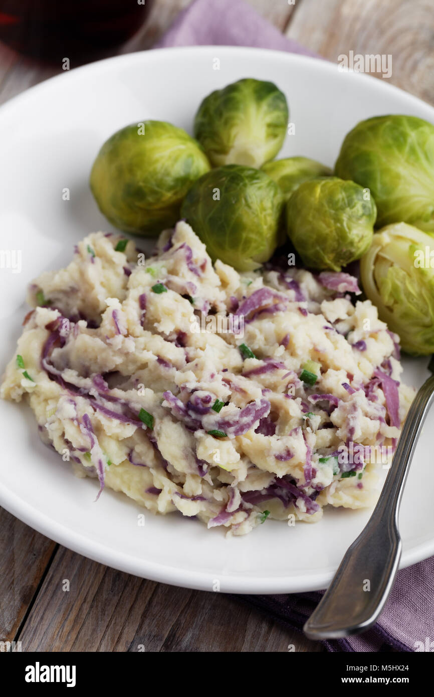Traditional Dutch dish Stamppot with mashed potato, red cabbage, green ...