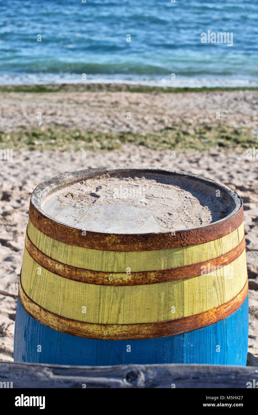 Old wooden colored barrel at the sea shore Stock Photo - Alamy