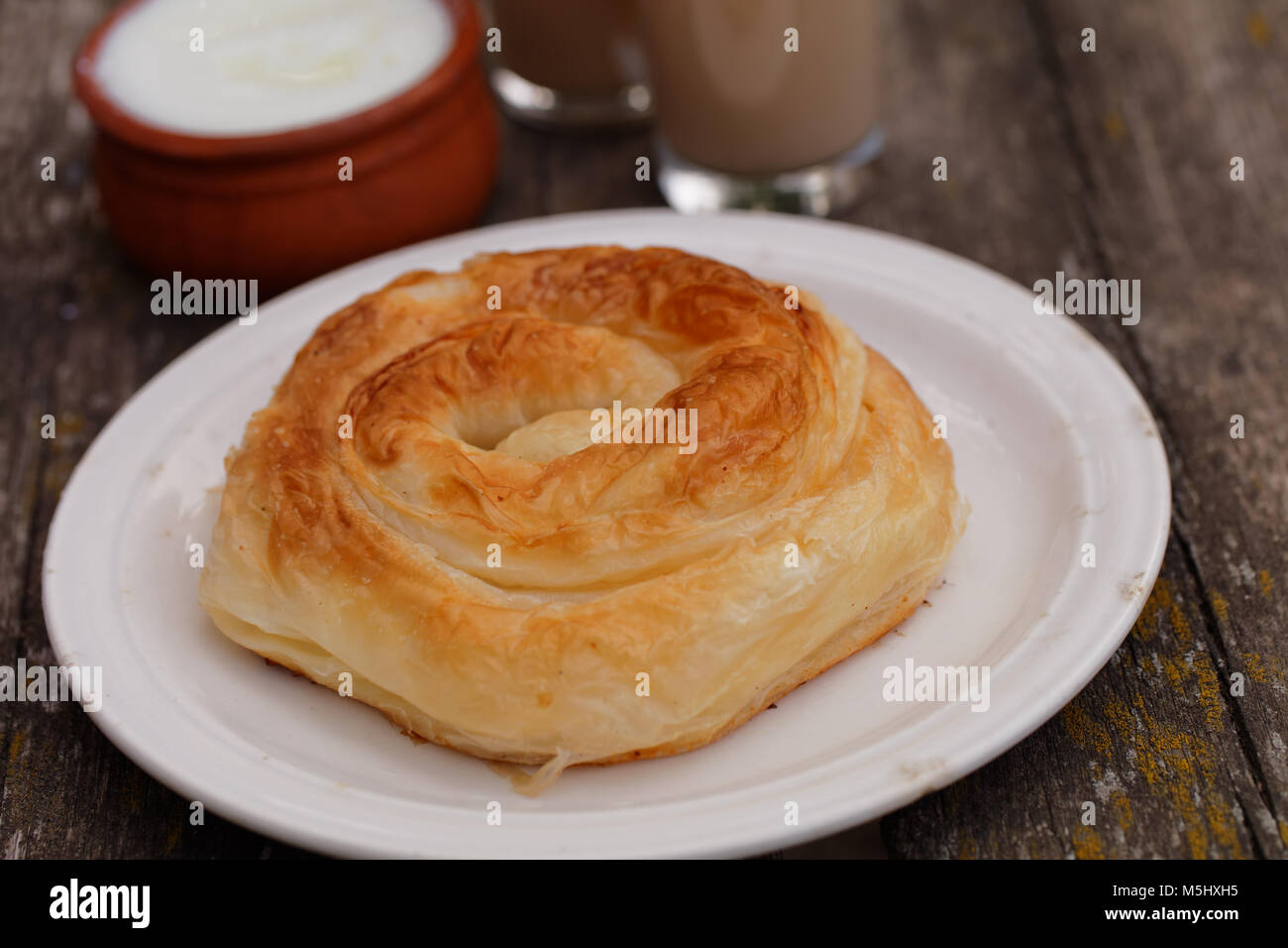 Traditional Bulgarian pastry Banitsa on a rustic table with Greek ...