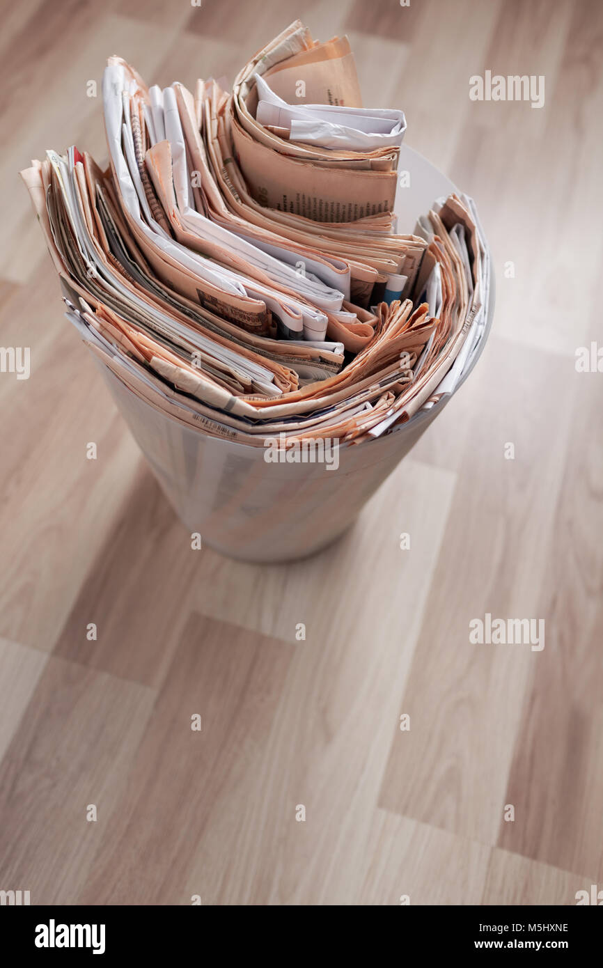 Old newspapers in the overloaded recycle bin Stock Photo - Alamy
