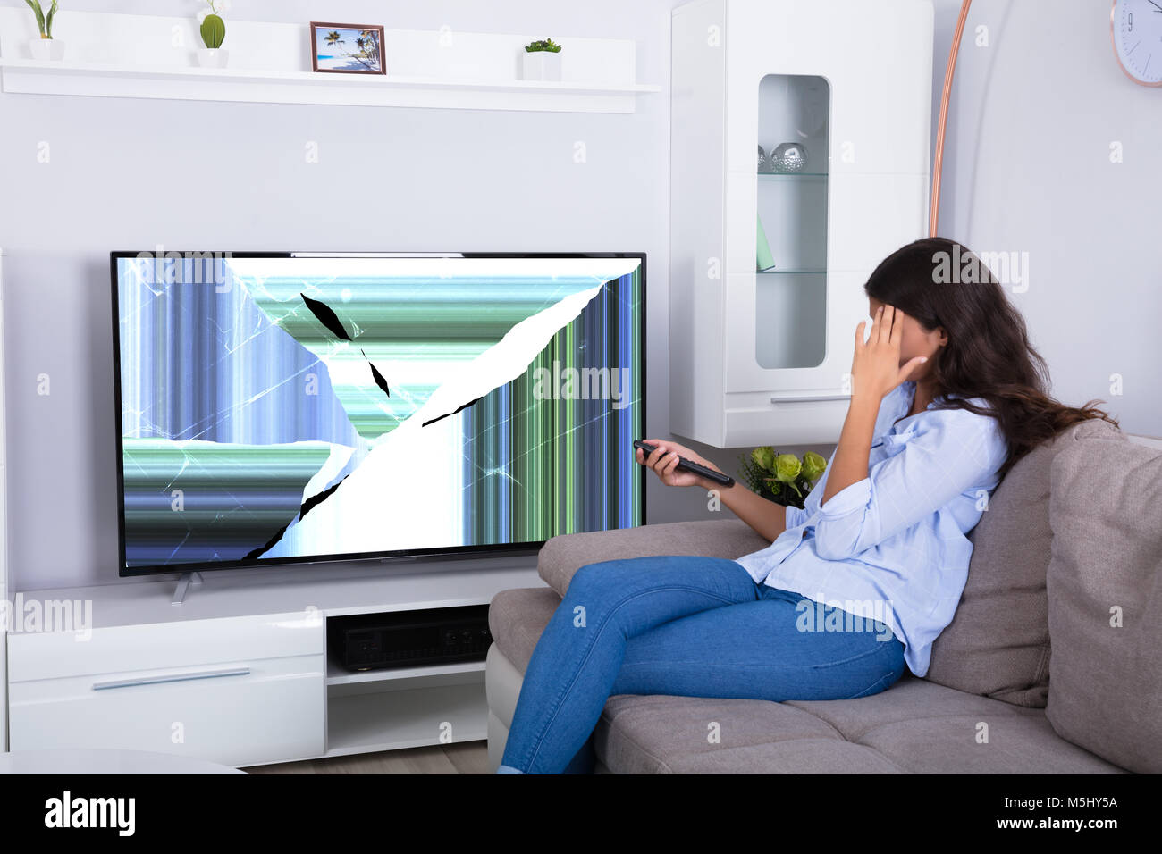 Female hand tv remote unhappy hi-res stock photography and images - Alamy