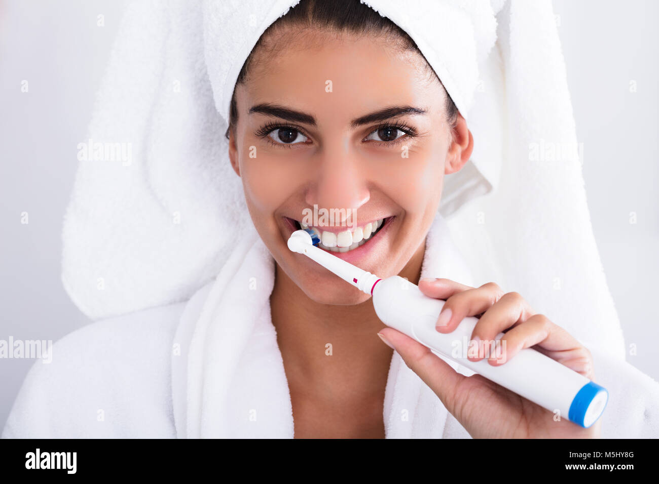 Beautiful female brushing teeth hi-res stock photography and images - Alamy