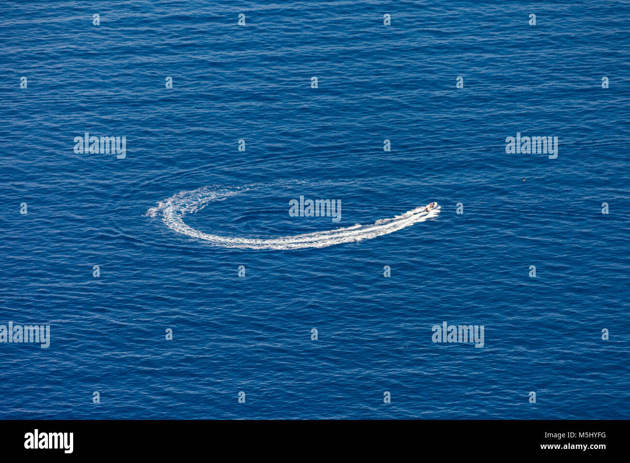 Aerial view of a speed boat in blue sea Stock Photo - Alamy