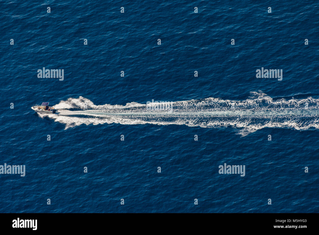 Aerial view of a speed boat in blue sea Stock Photo - Alamy