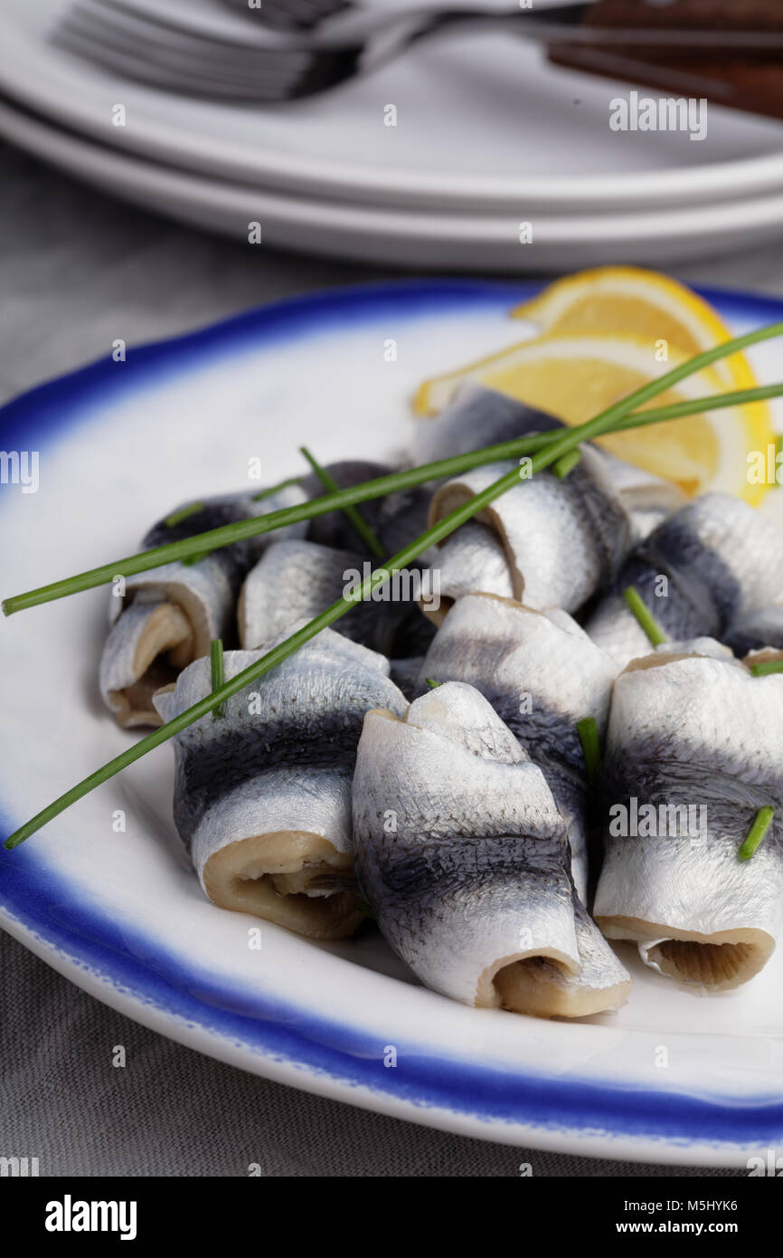 Rollmops the traditional German herring fillet rolls with green onion ...