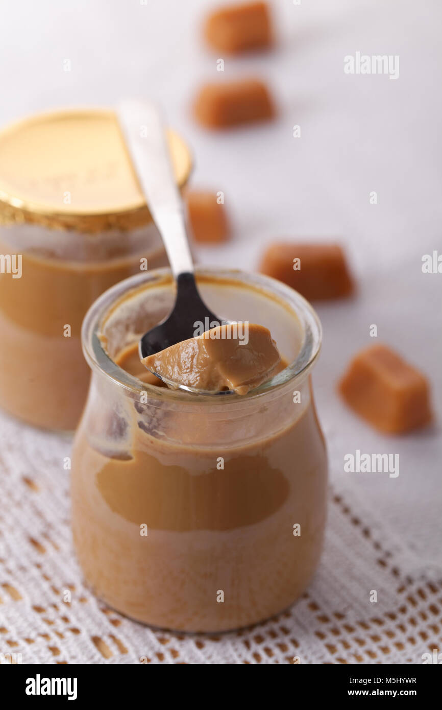 Jar with toffee yogurt closeup Stock Photo - Alamy