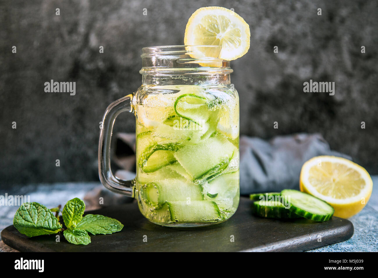 Detox water, cucumber water, lemon, mint in a glass Stock Photo - Alamy