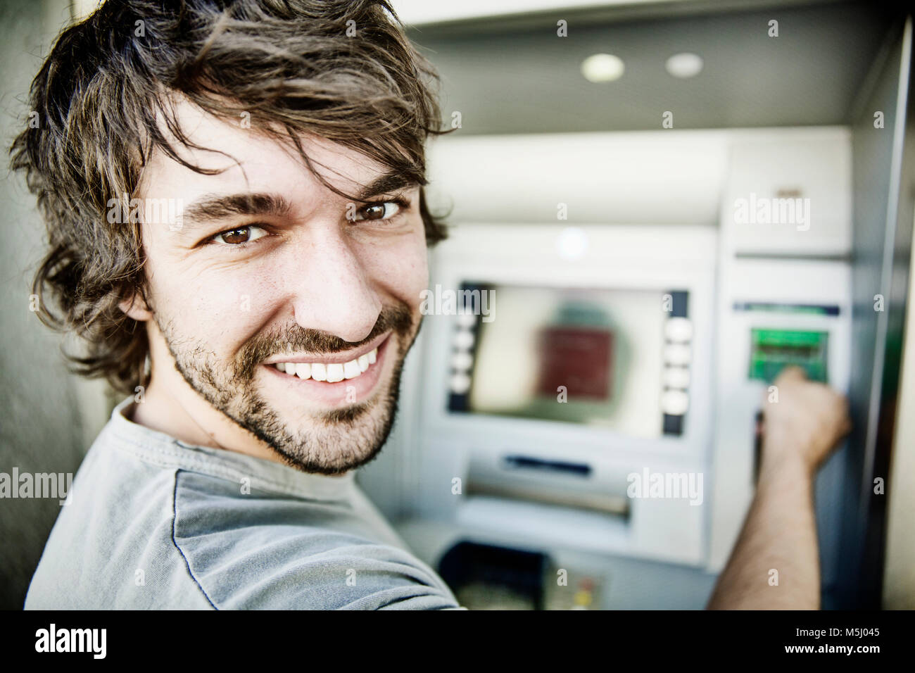 Person using cash machine hi-res stock photography and images - Alamy