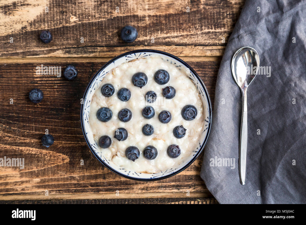 Pudding rice with blueberry Stock Photo - Alamy