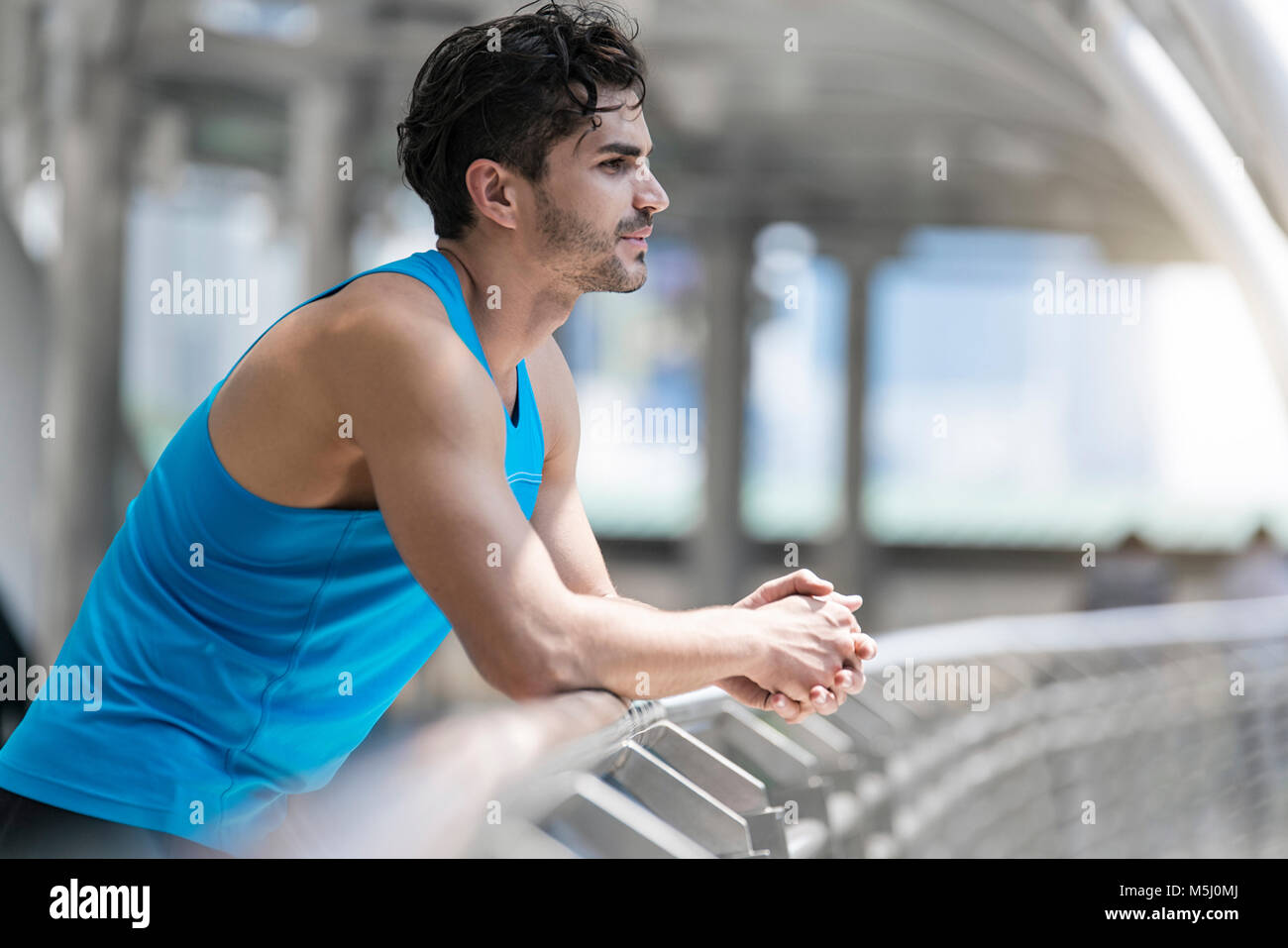 Runner taking a break in the city Stock Photo - Alamy
