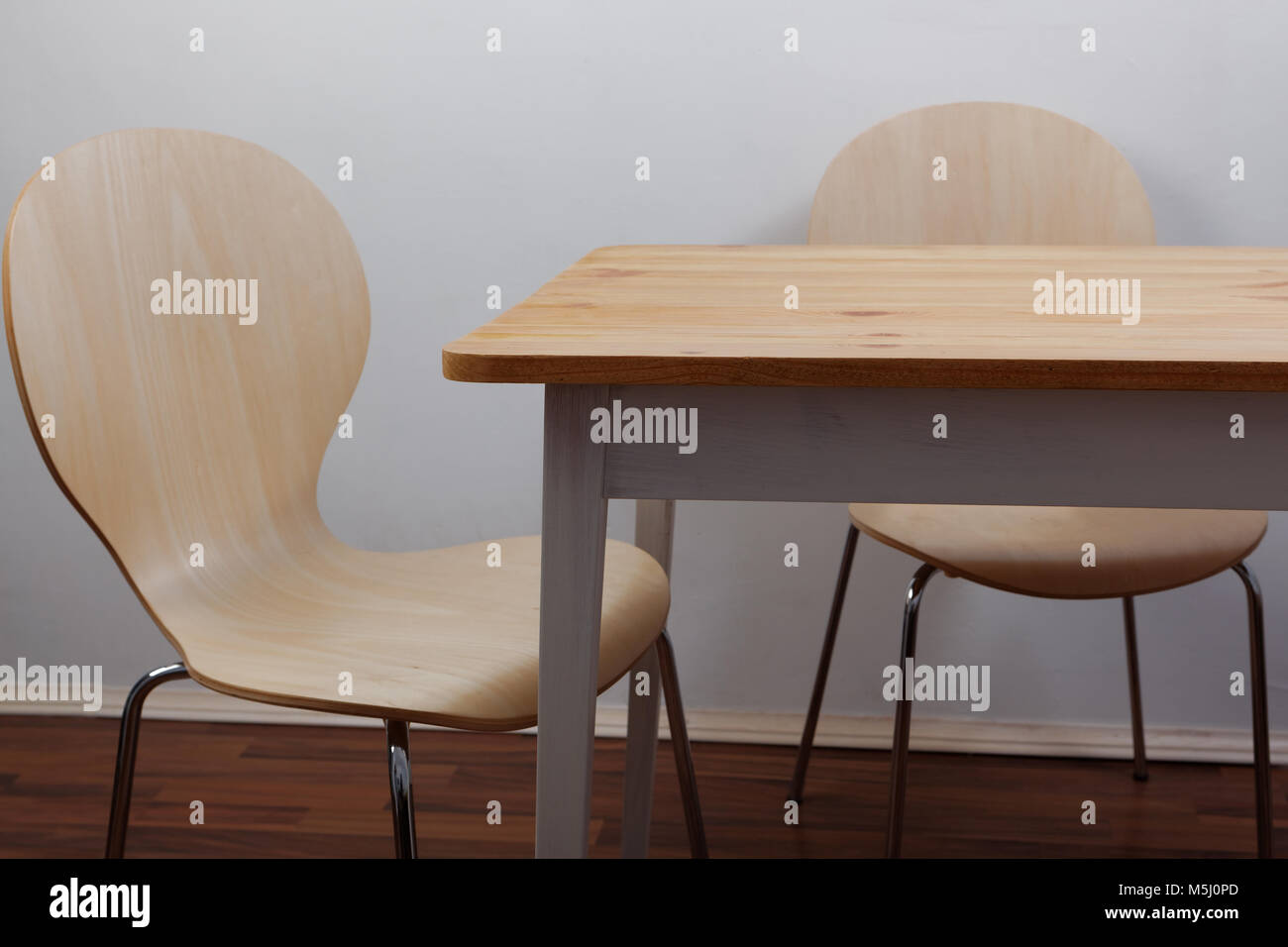 Table and chairs in a room Stock Photo - Alamy
