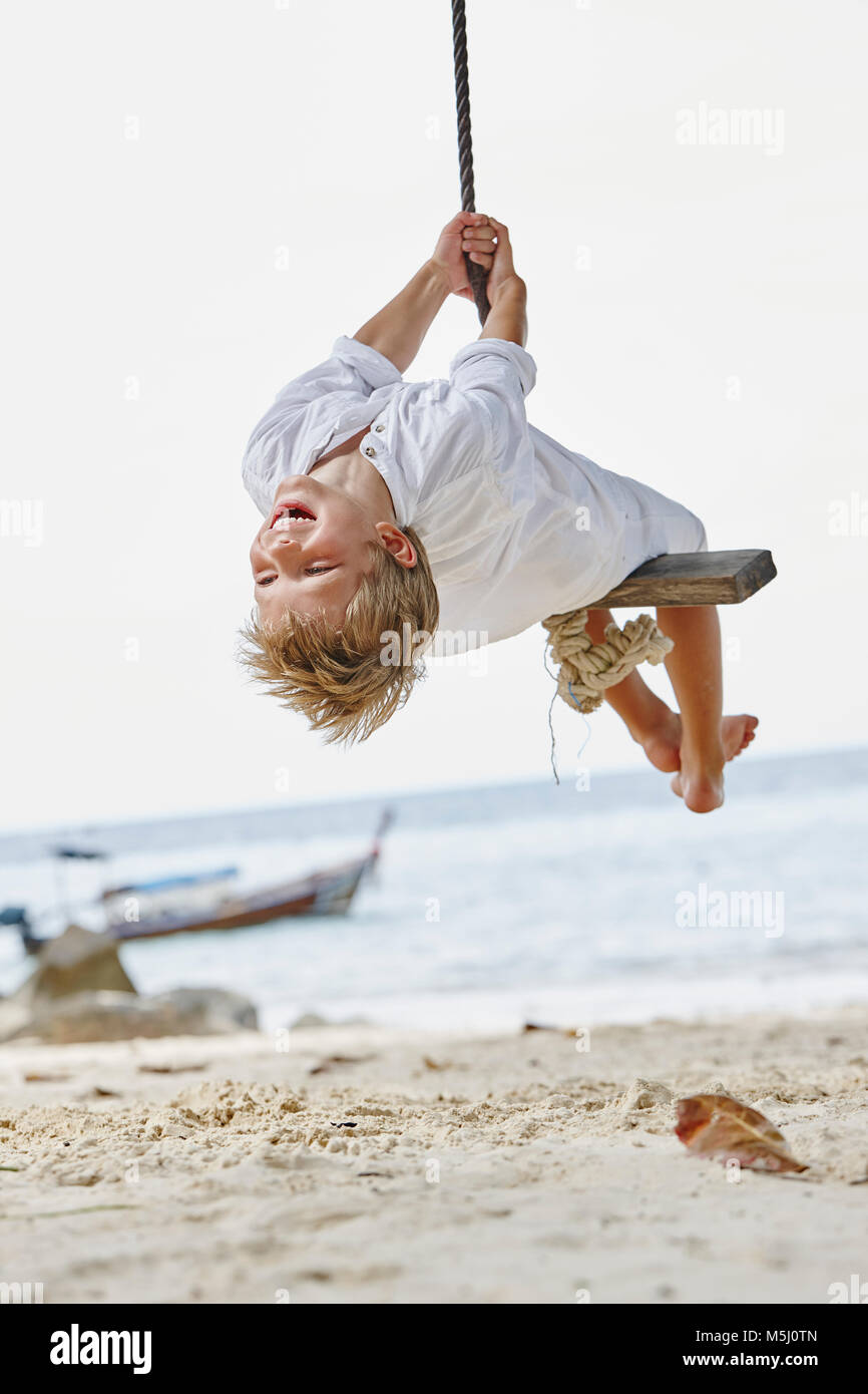 Child swinging on rope hi-res stock photography and images - Alamy