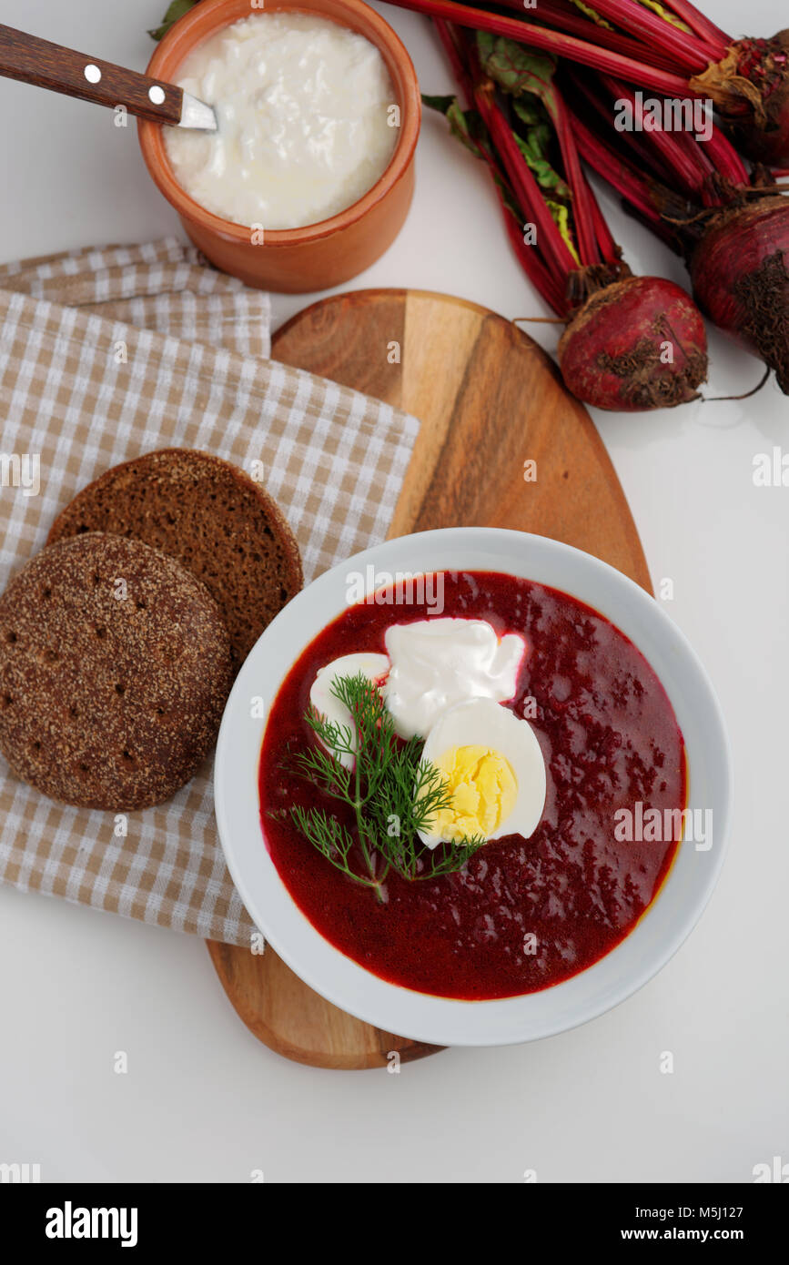 Traditional Polish beetroot soup with boiled egg and sour cream on a ...