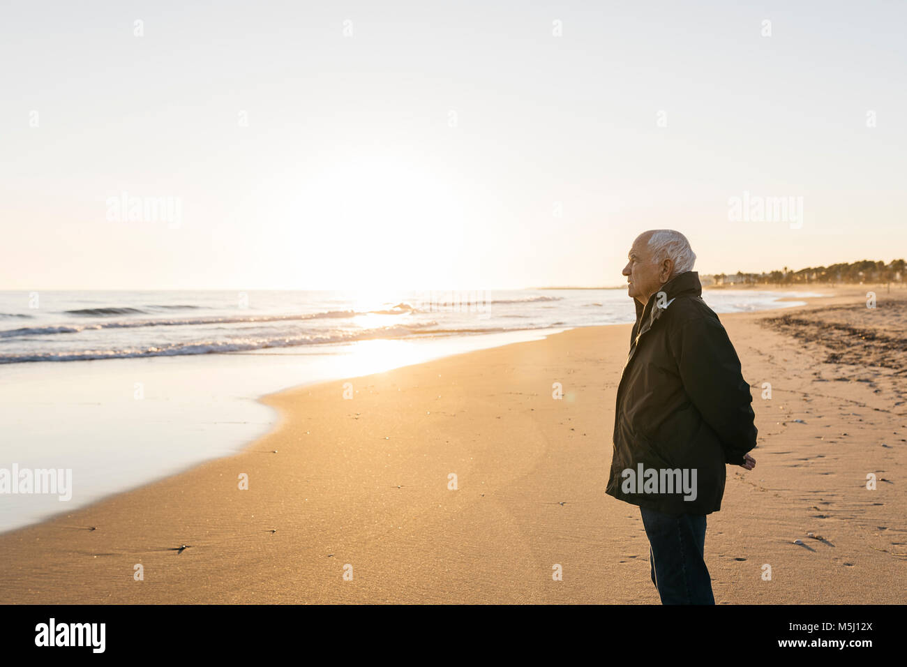 Senior man looking at the sea Stock Photo - Alamy
