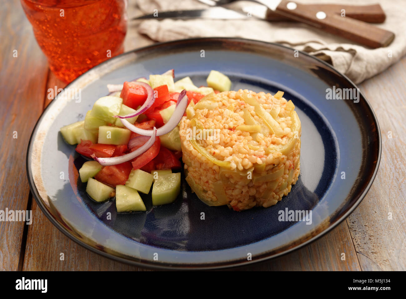 Pilaf with pepper and vegetable salad Stock Photo - Alamy