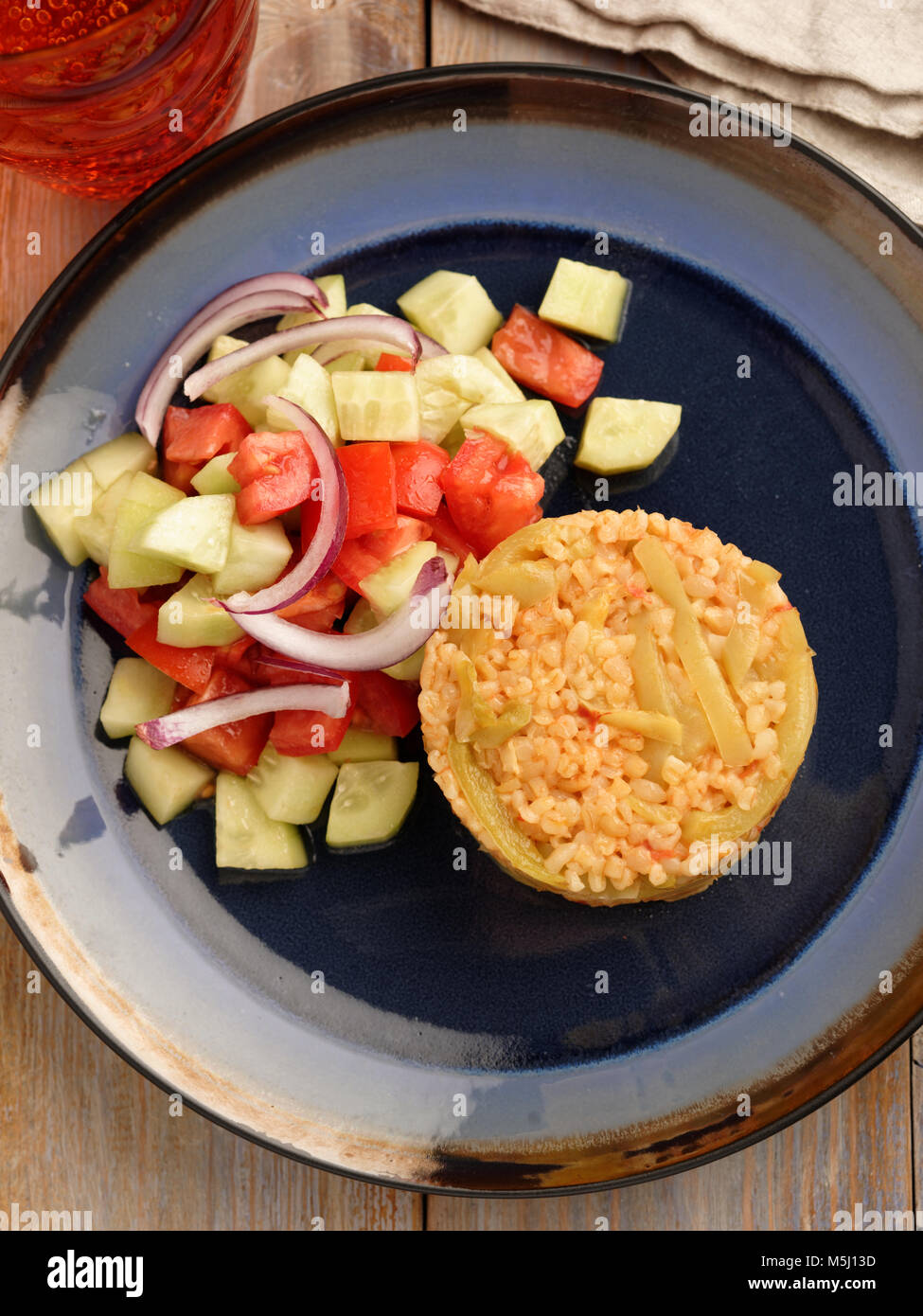 Pilaf with pepper and vegetable salad Stock Photo - Alamy