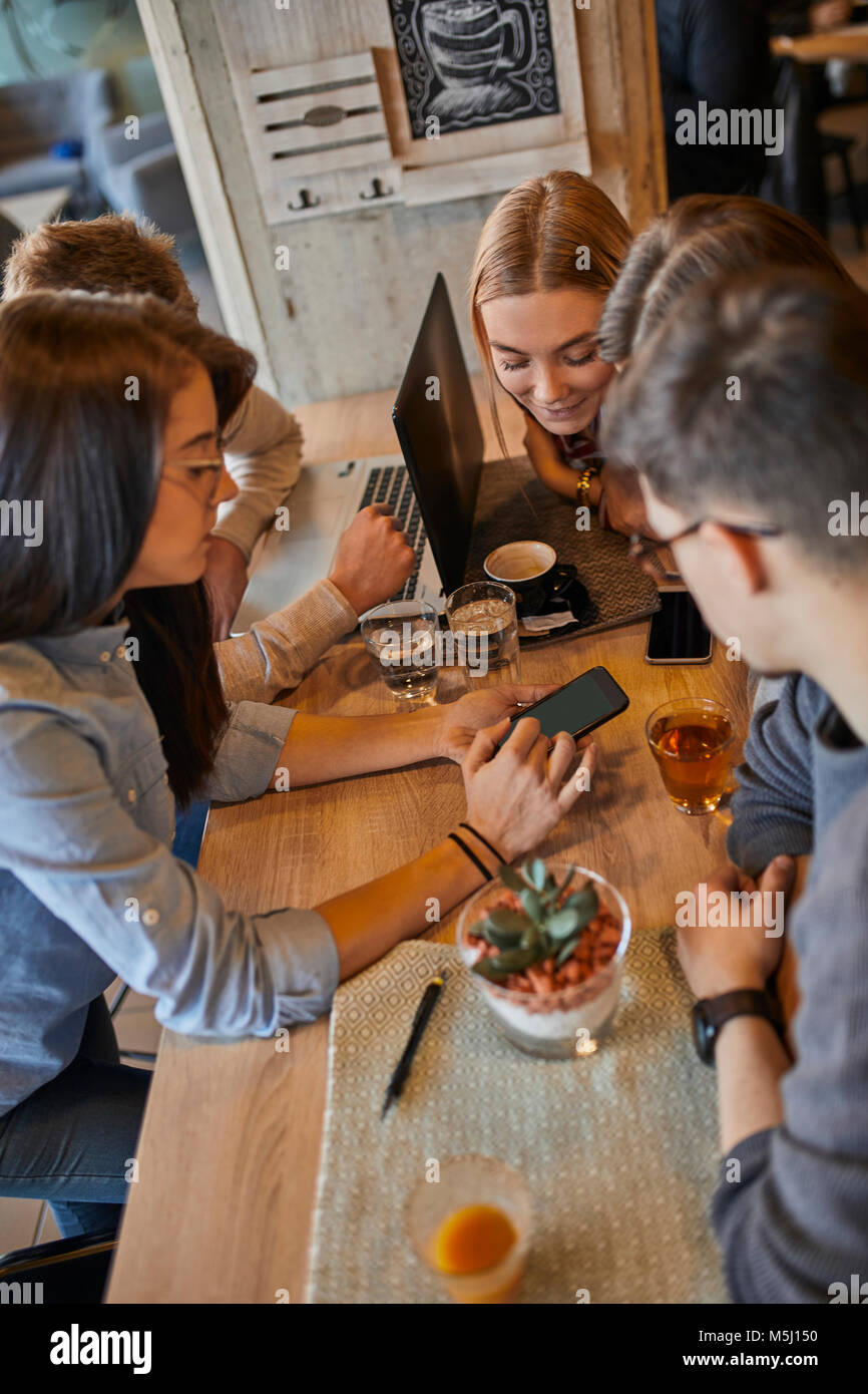 Group friends chatting in cafe hi-res stock photography and images - Alamy