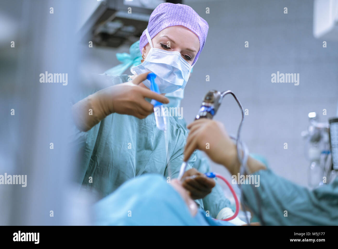 Surgeon nurse during operation in hi-res stock photography and images ...