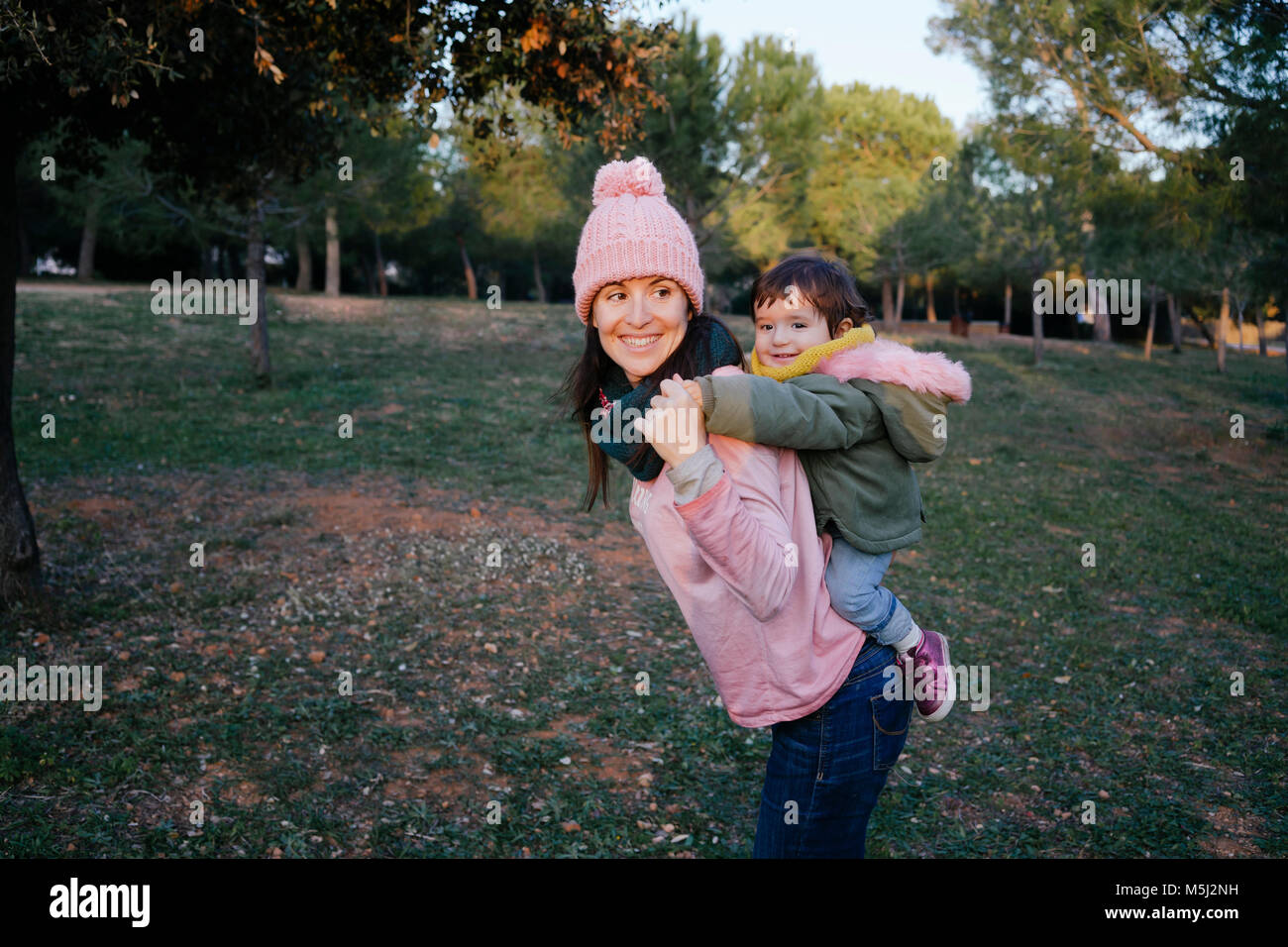 Child on piggyback hi-res stock photography and images - Alamy