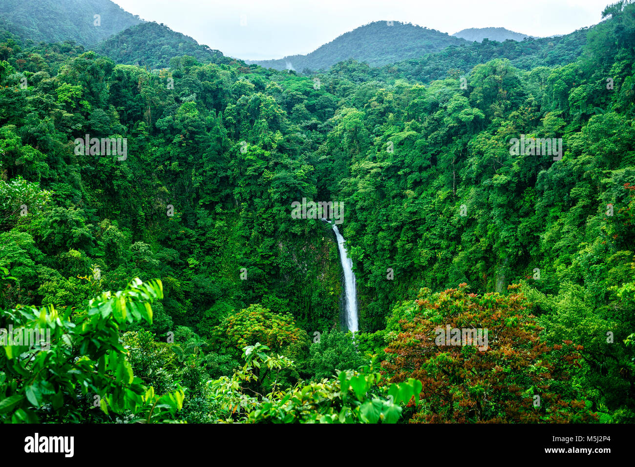 Arenal volcano national park with the waterfall of la fortuna hi-res ...