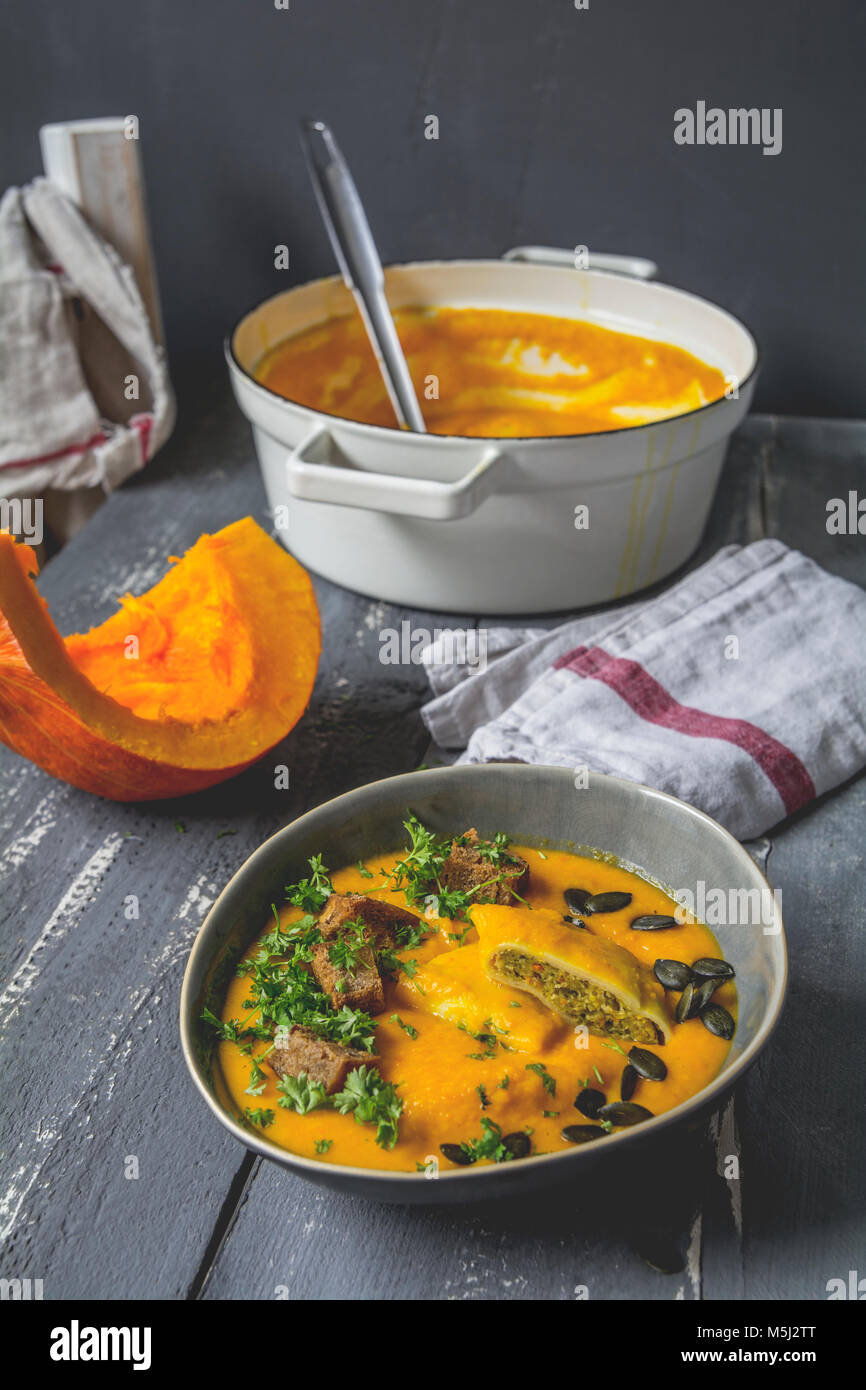 Pumpkin soup with swabian pockets and croutons, parsley and pumpkin ...