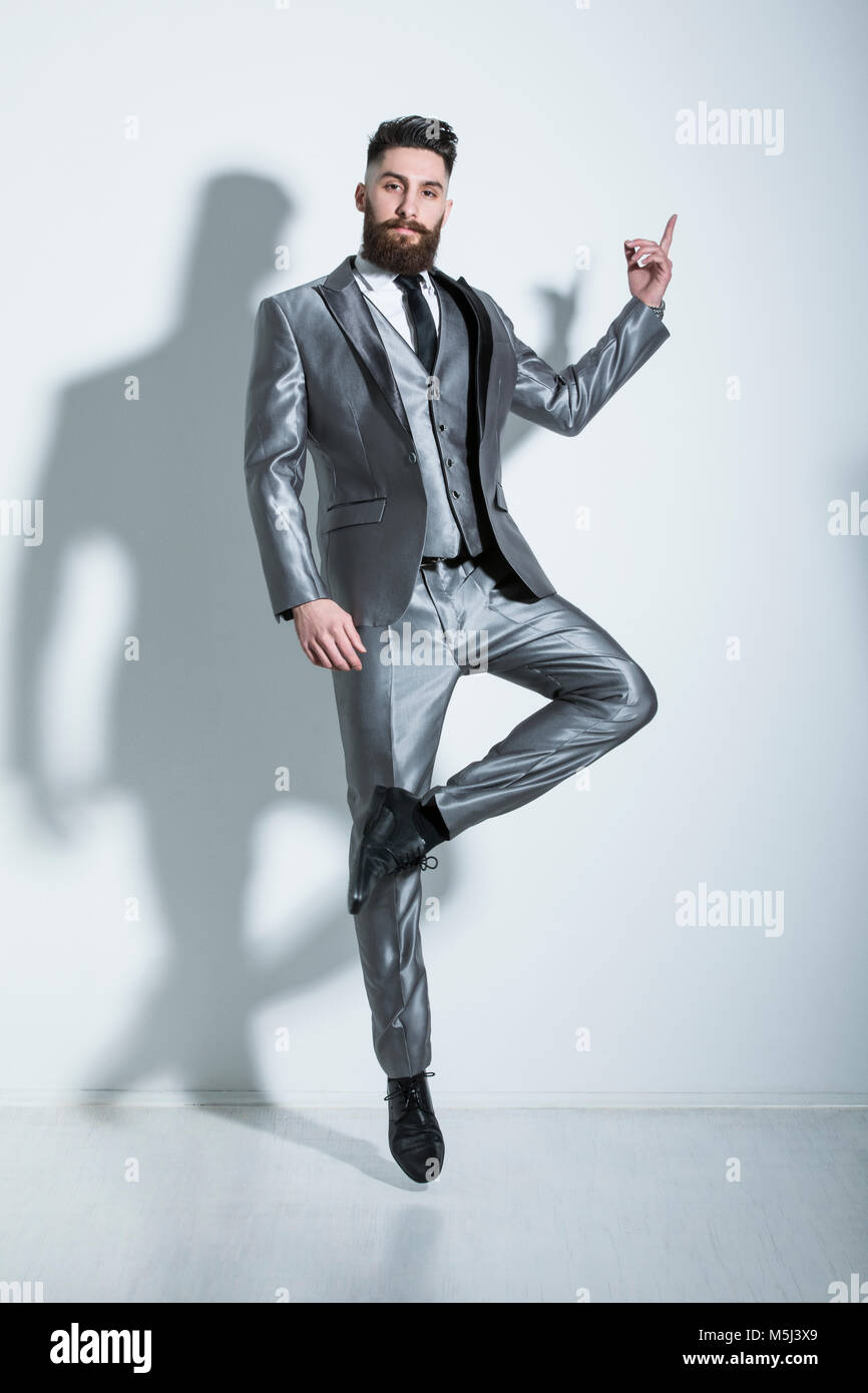 Elegant young man jumping and dancing gracefully Stock Photo - Alamy