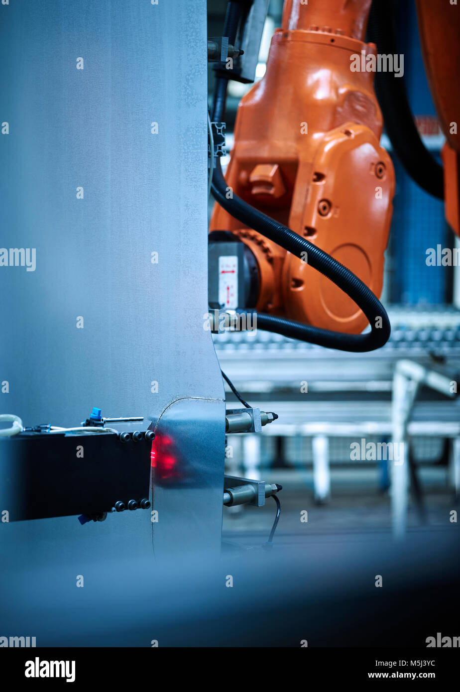 Industrial robot arm used in metalworking Stock Photo - Alamy