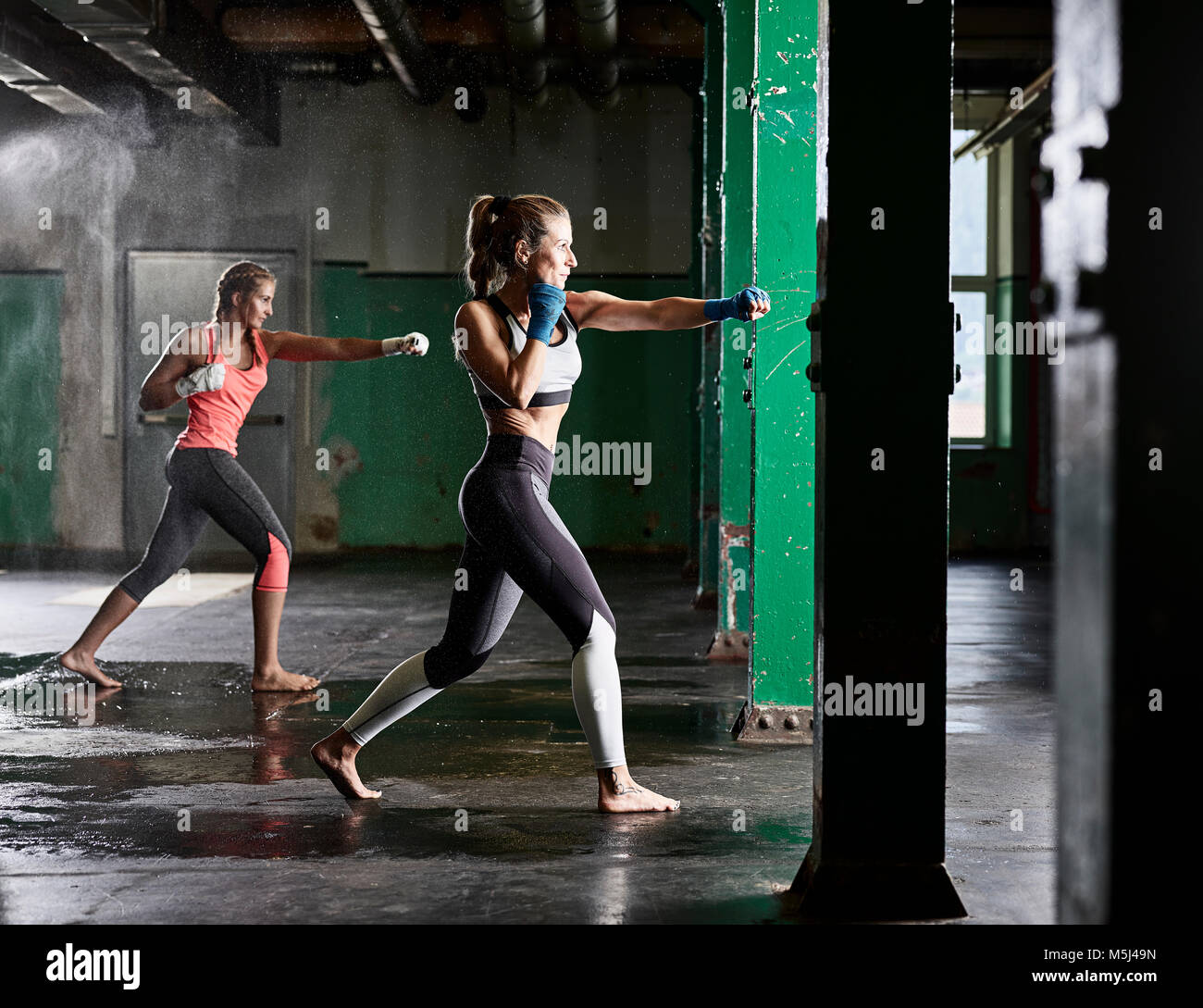 Two women having martial arts training Stock Photo - Alamy