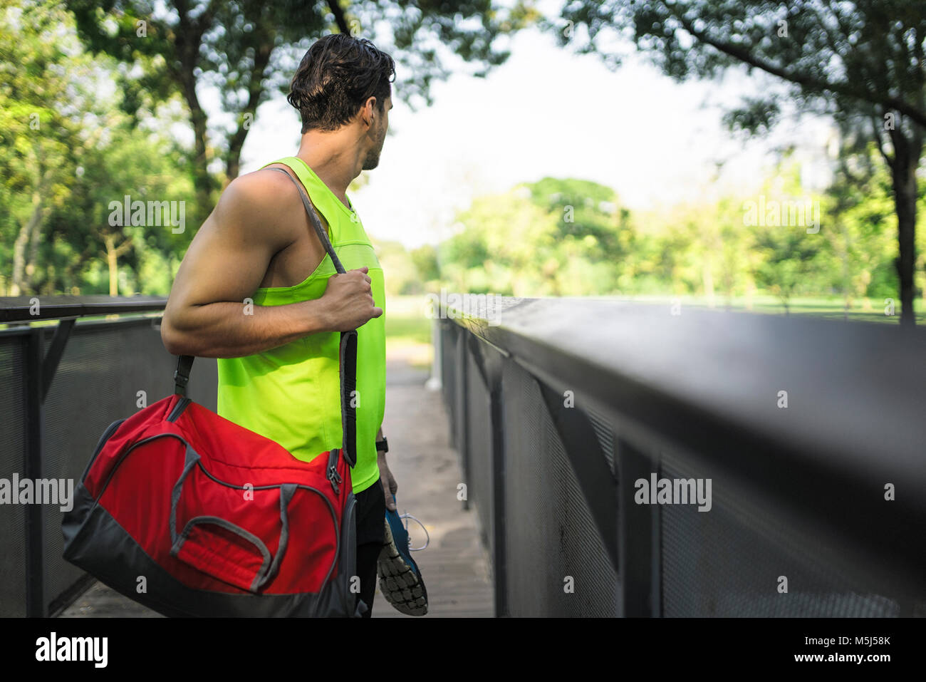 Person carrying bag hi-res stock photography and images - Alamy