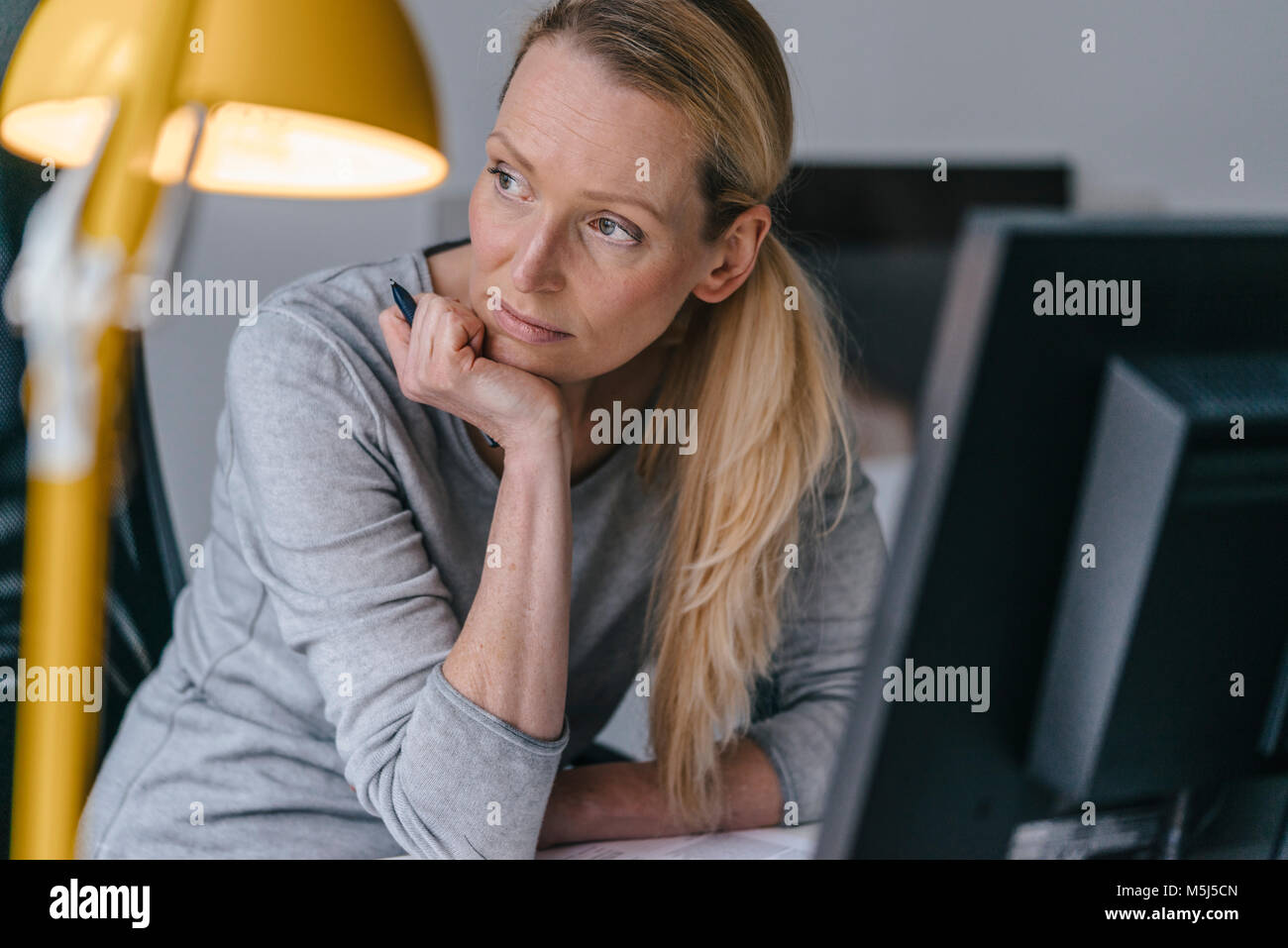 Thinking pensive business woman sitting hi-res stock photography and ...