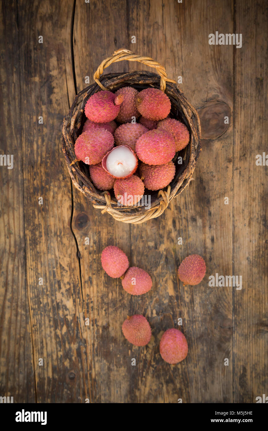 Lychee in basket, on wood Stock Photo - Alamy