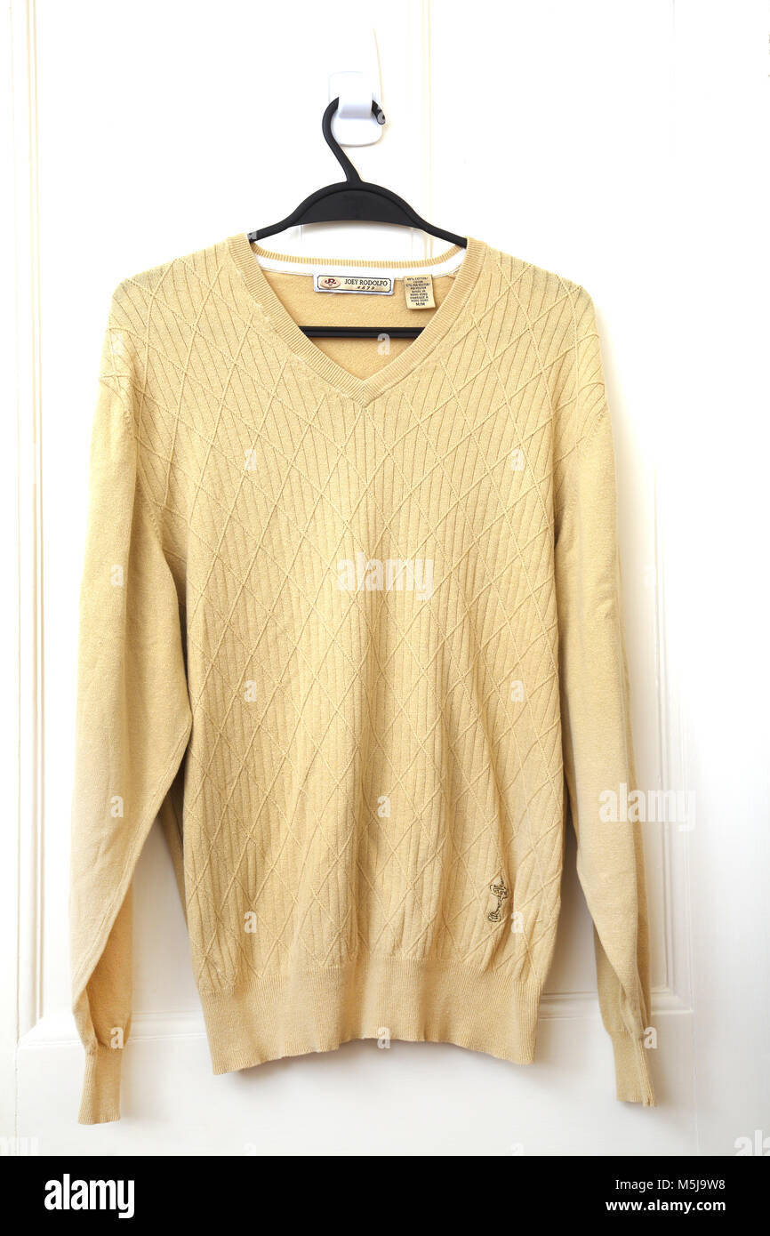 Cream Joey Rodolfo Cotton Jumper hanging on Door Stock Photo - Alamy