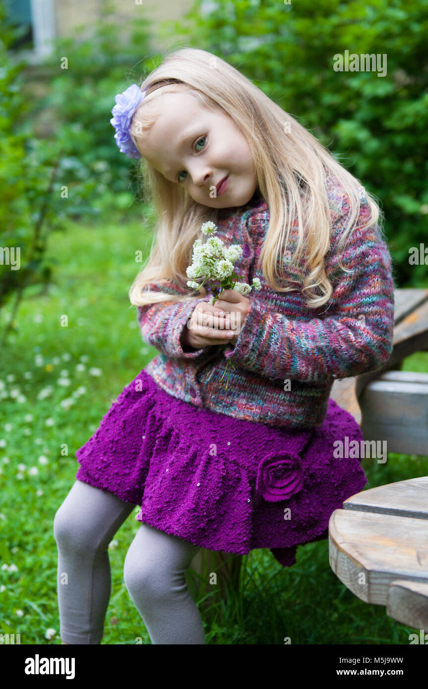 little beautiful blond girl in nature Stock Photo - Alamy