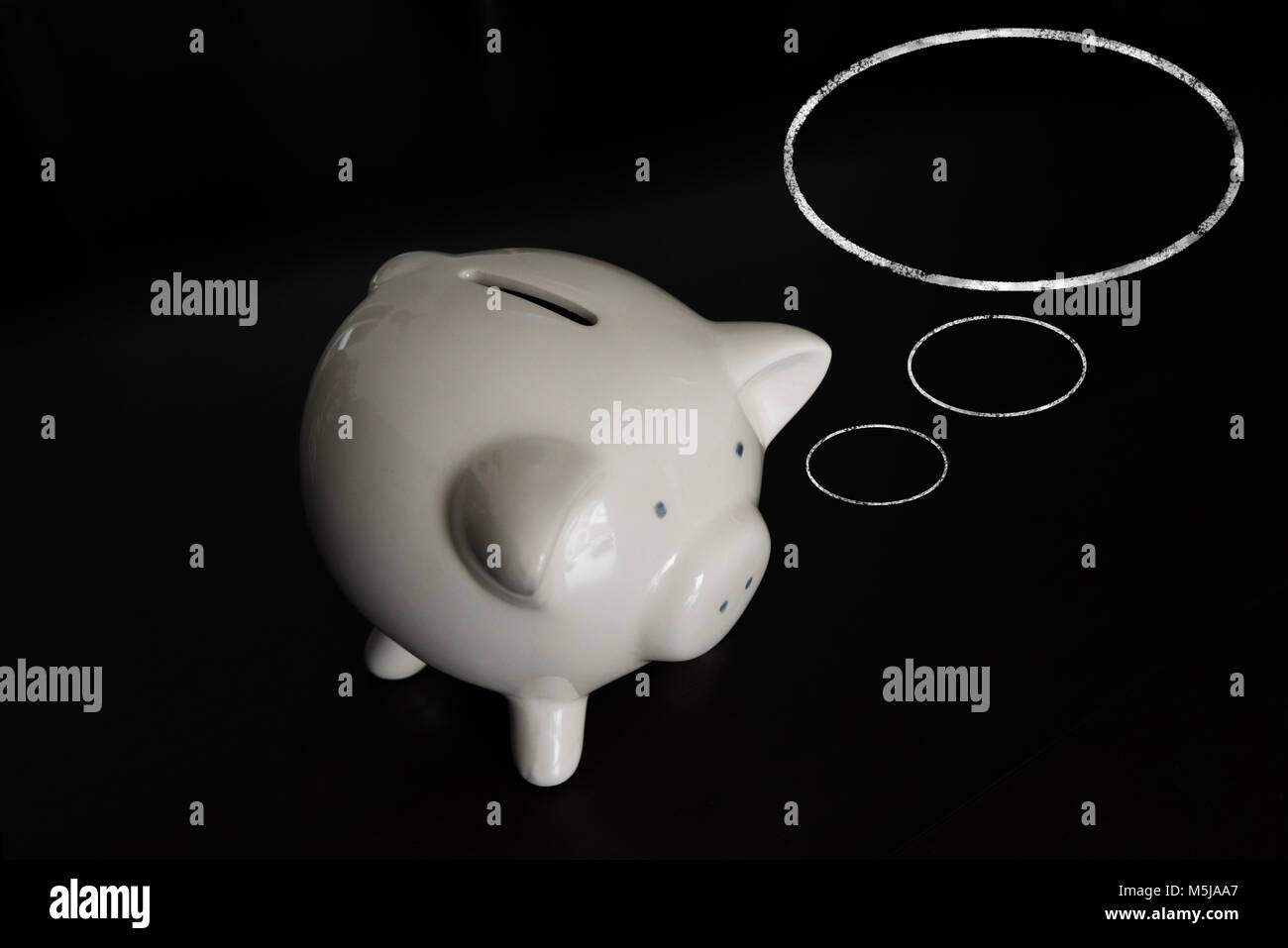 Piggy bank with thought bubbles and room for your text Stock Photo - Alamy