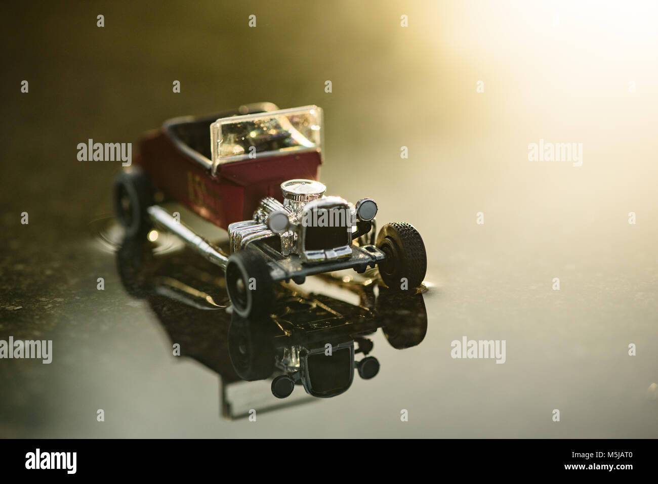 Red classic car on reflective and shiny background Stock Photo - Alamy