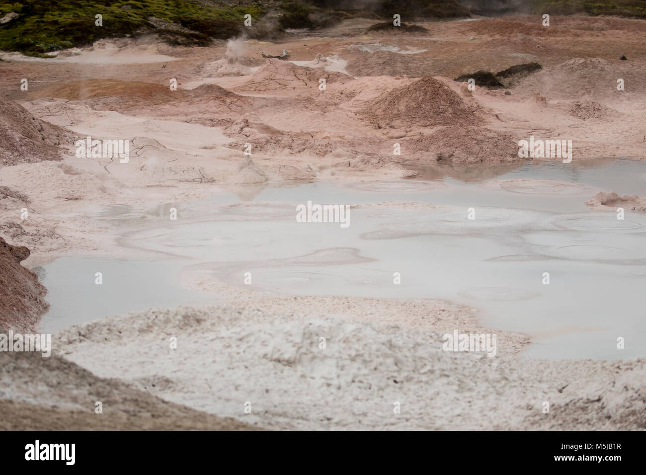 Landscape of boiling mud pots and steaming geyser vents at Fountain ...